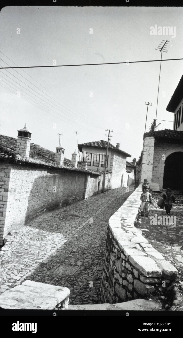 A CHILD STANDING NEAR A STOOP; NEAR AN ALLEY Stock Photo - Alamy