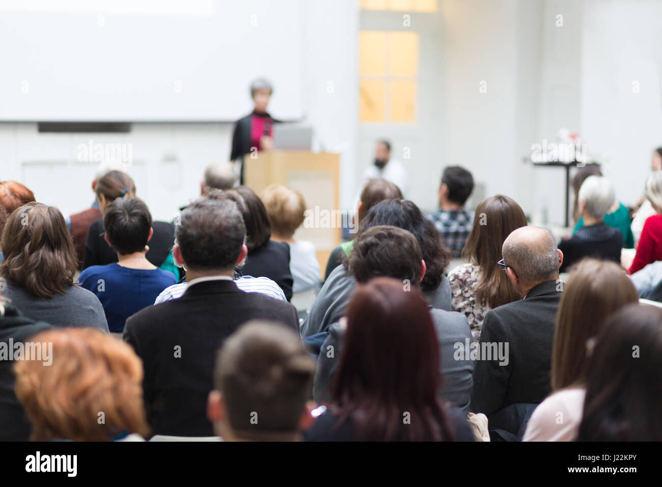Woman giving presentation on business conference Stock Photo - Alamy