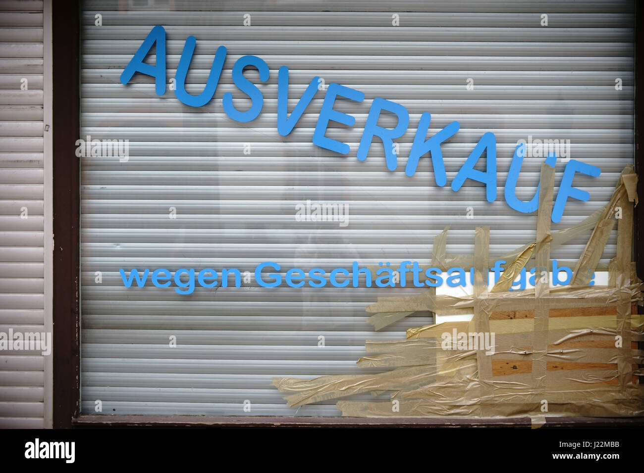 The photograph of a shop window shattered by theft, of a shop closed ...