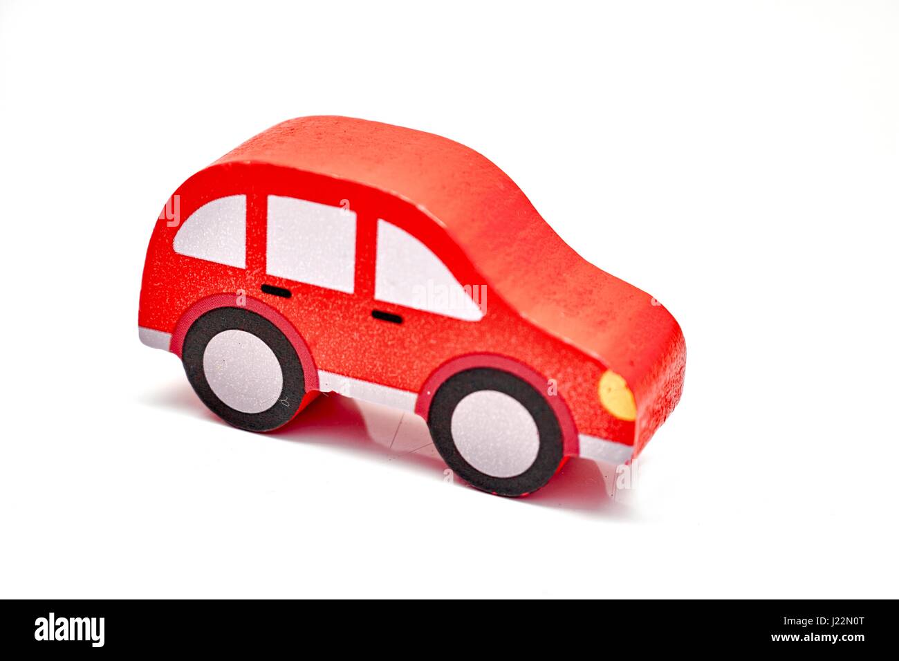 A conceptual photo of a little red car Stock Photo - Alamy