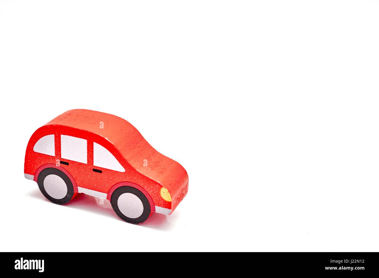 A conceptual photo of a little red car Stock Photo - Alamy