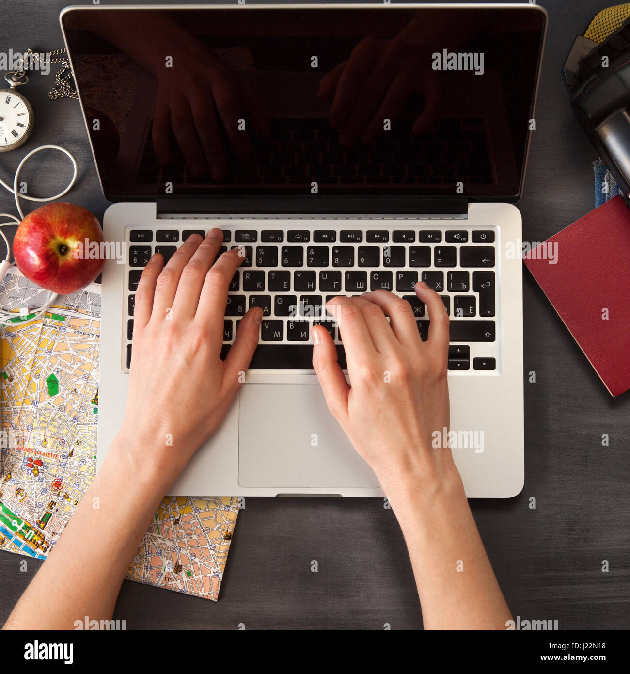 Young girl sitting at the table, working on laptop Stock Photo - Alamy