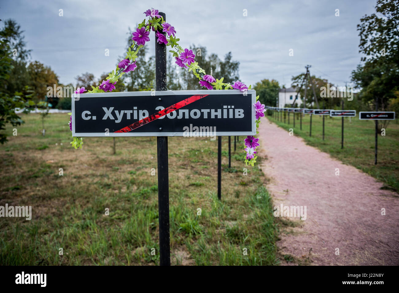 Alley with a signs of displaced villages in Chernobyl town, Chernobyl ...