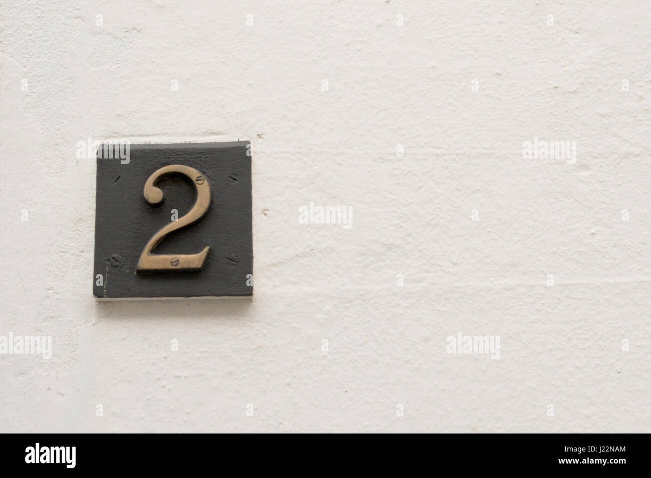 House number 2 sign on wall Stock Photo - Alamy