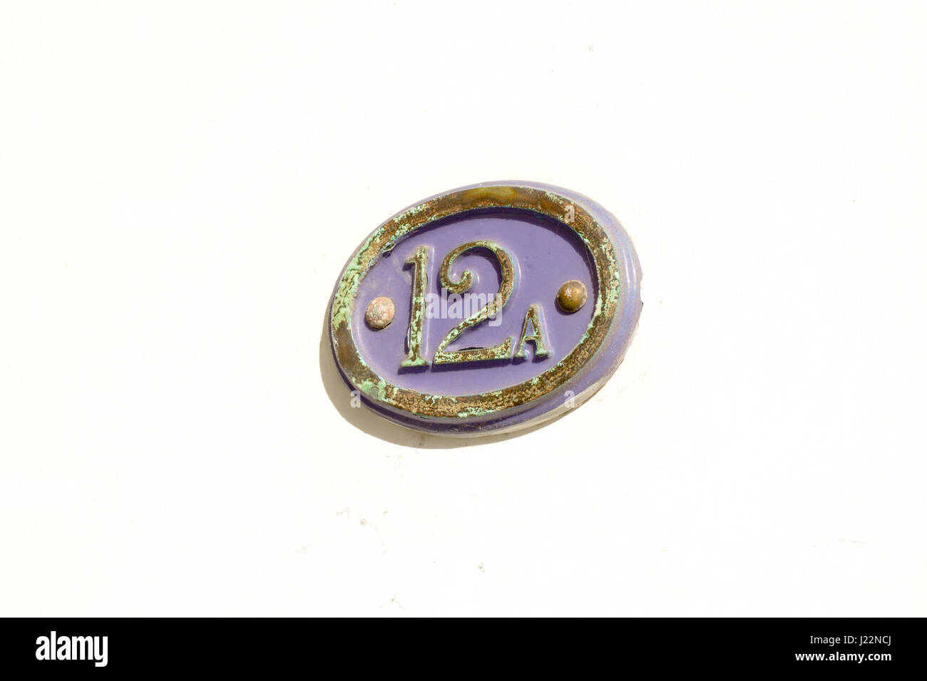 House number 12A sign on wall Stock Photo - Alamy