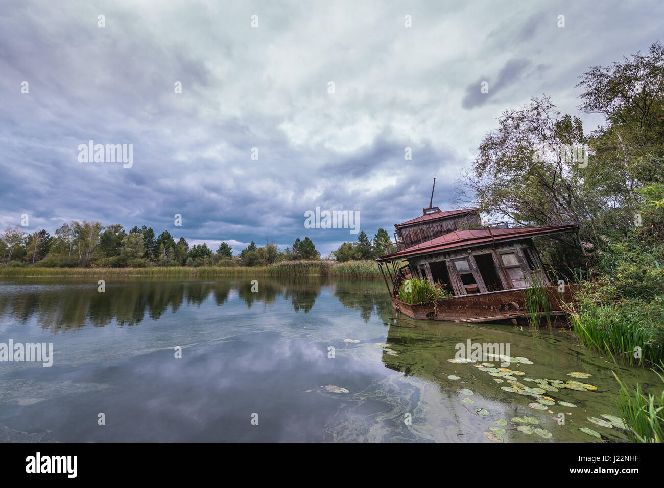 Sinking boat on a Yanov backwater in Pripyat ghost city of Chernobyl ...