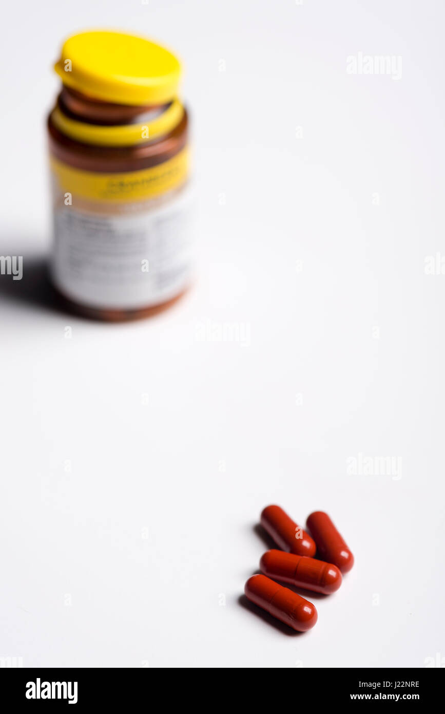Pills and medicines over a white board with optical bokeh effect Stock ...