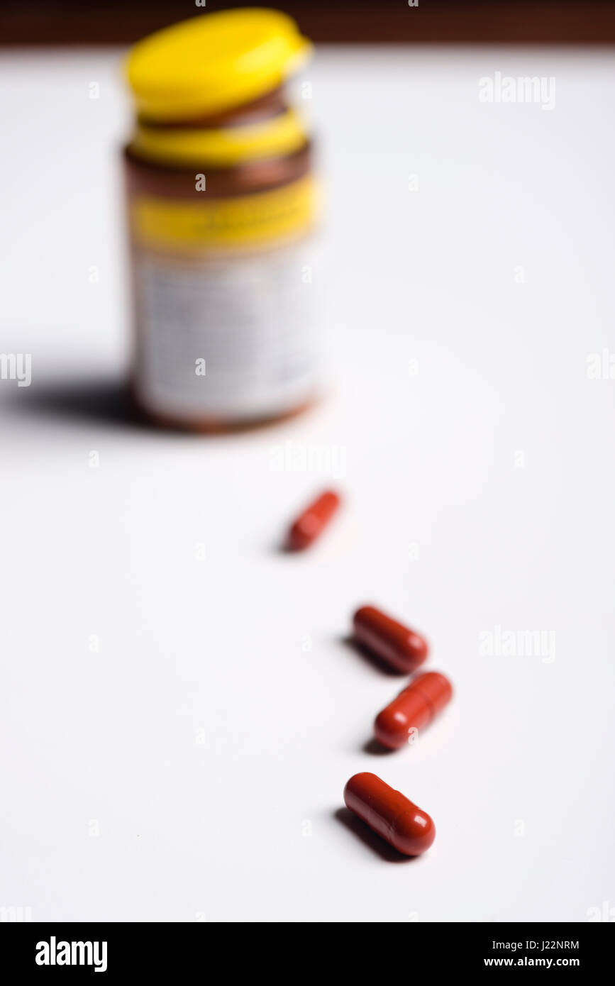 Pills and medicines over a white board with optical bokeh effect Stock ...