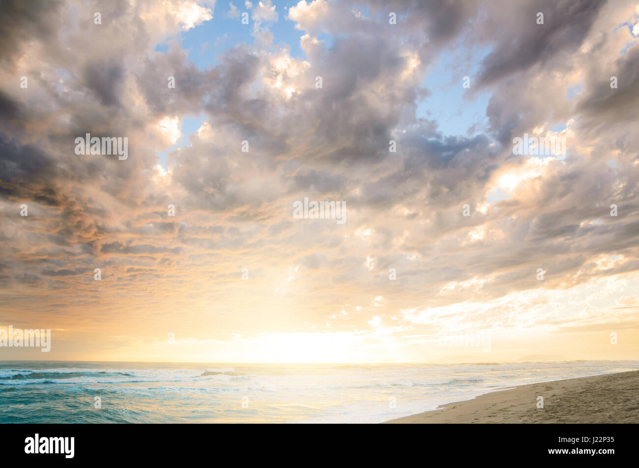 Cloudy sea sunset Stock Photo - Alamy