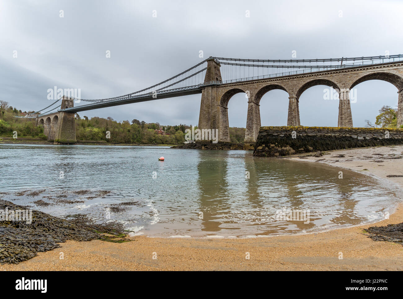 View of the Menai Bridge on Anglesey Stock Photo - Alamy