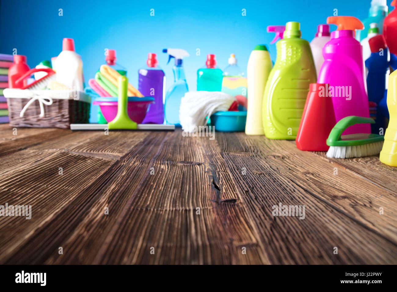 Spring cleanup theme. Variety of colorful house cleaning products on a ...