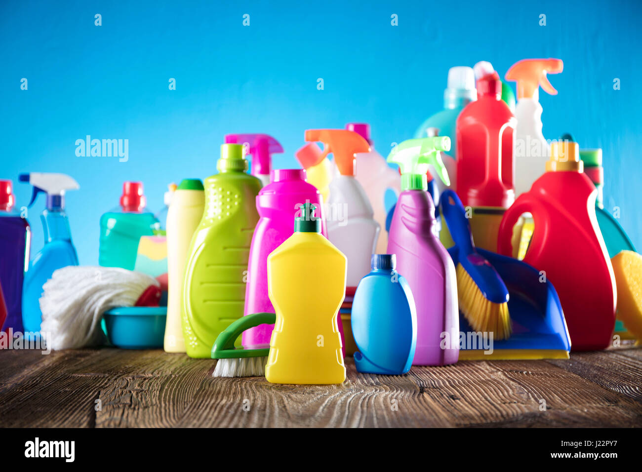 Spring cleanup theme. Variety of colorful house cleaning products on a ...