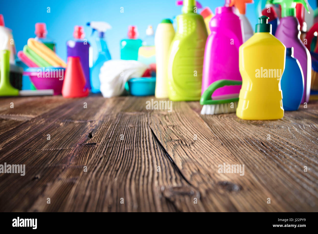 Spring cleanup theme. Variety of colorful house cleaning products on a ...