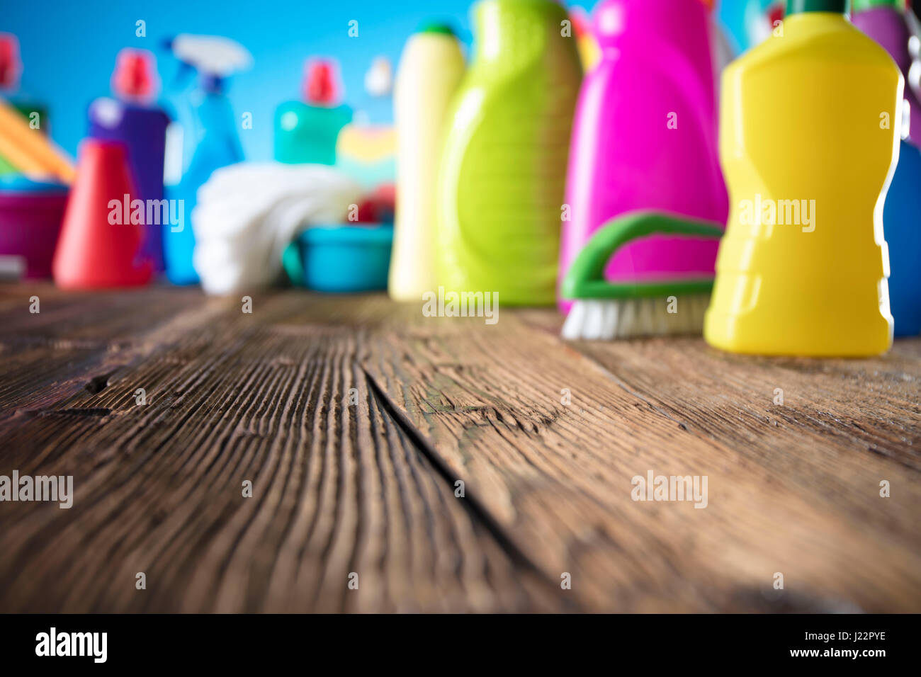 Spring cleanup theme. Variety of colorful house cleaning products on a ...