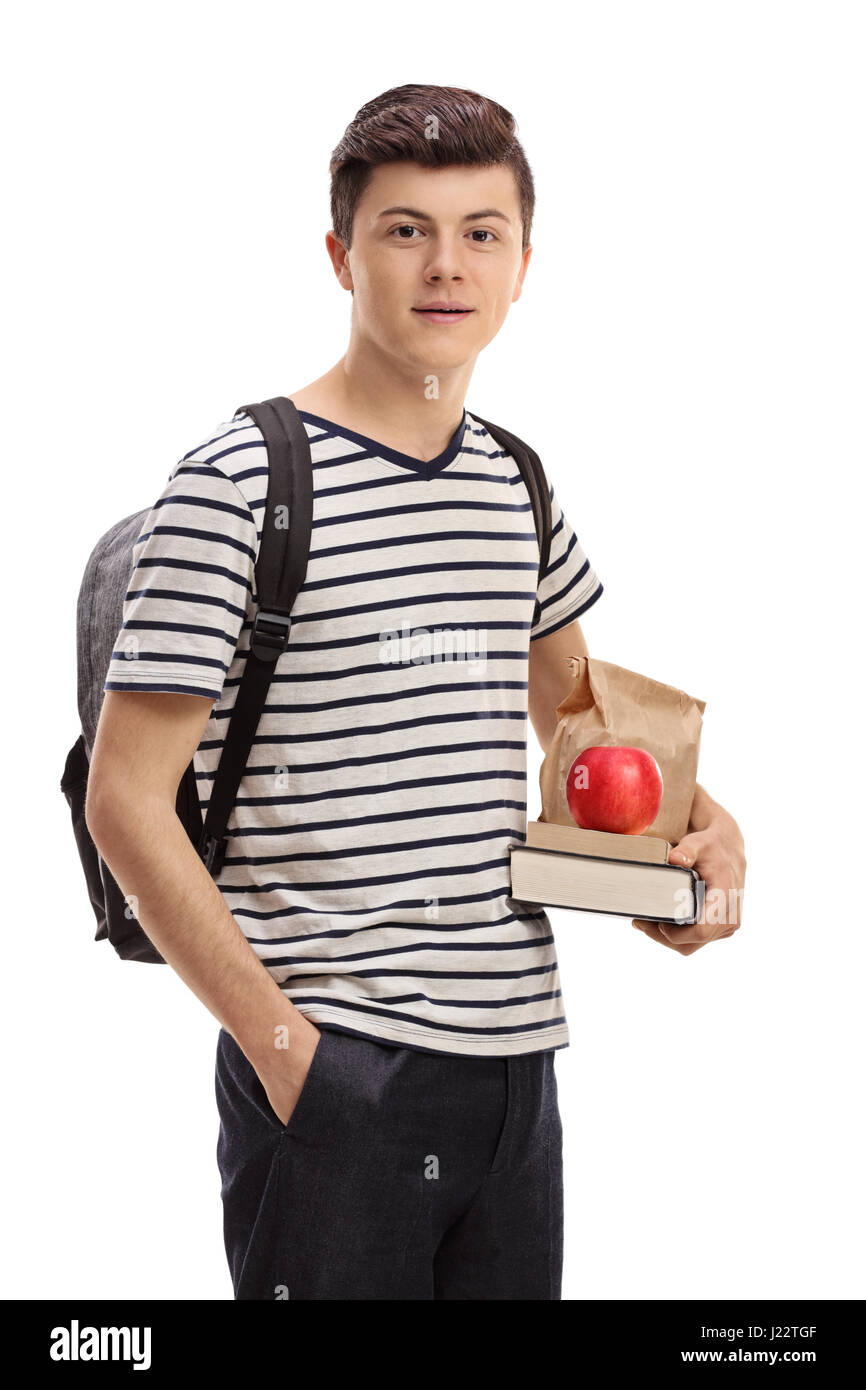 Teenage student holding books and a snack isolated on white background ...