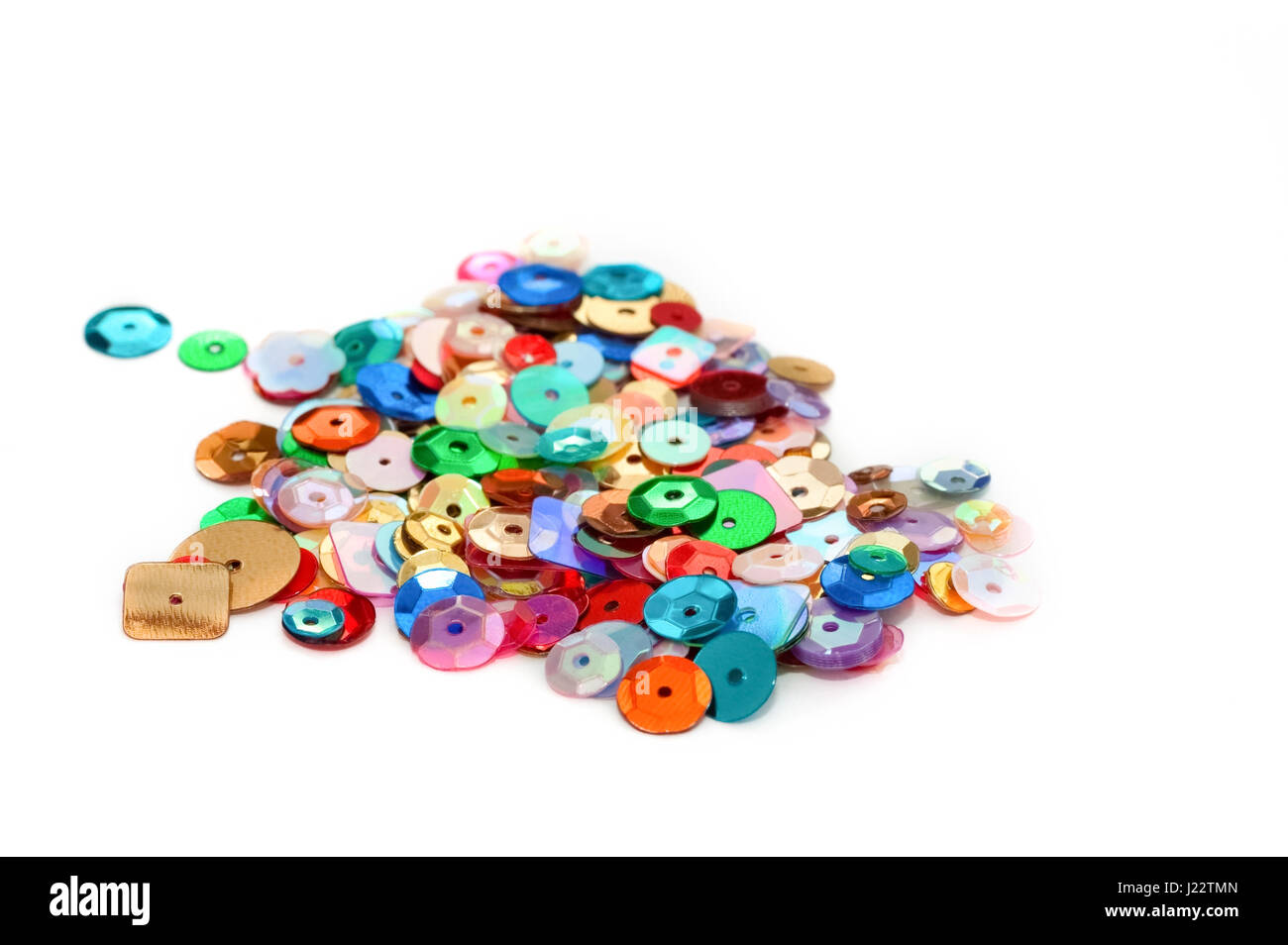 decorative craft sequins on a white background Stock Photo - Alamy