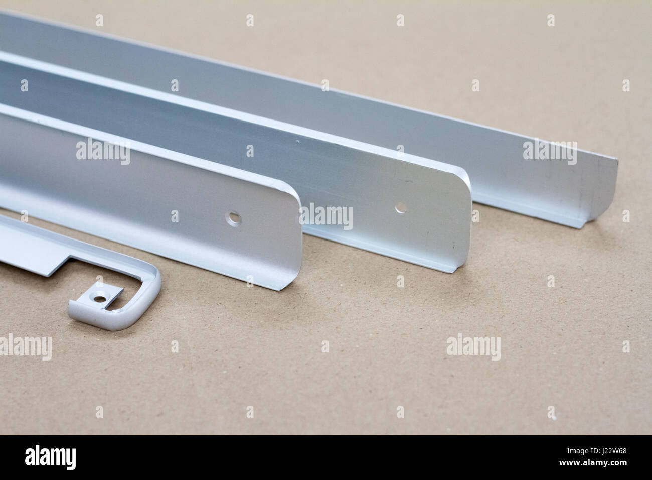 Bent metal profile channel. Furniture fittings Stock Photo - Alamy