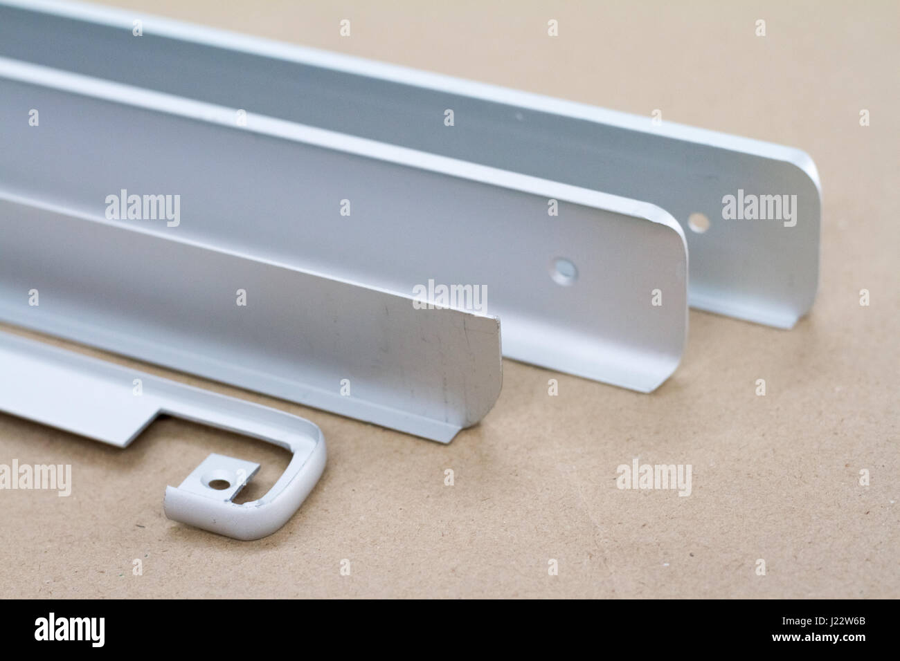 Bent metal profile channel. Furniture fittings Stock Photo - Alamy