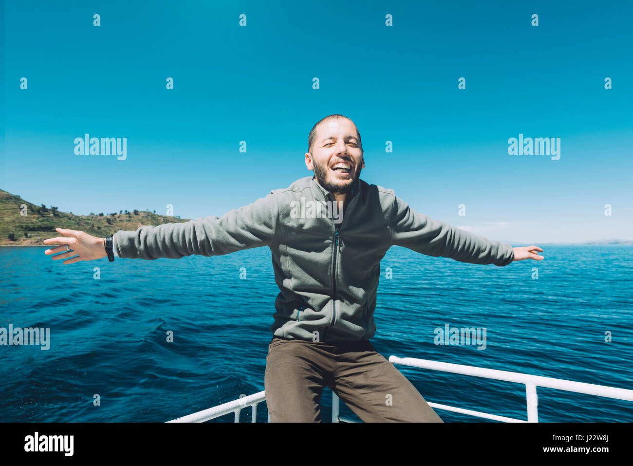 Peru happy man open arms boat sailing lake titicaca hi-res stock ...