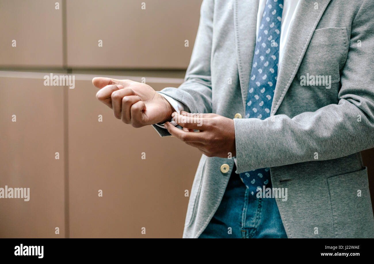 Businessman adjusting his cuffs hi-res stock photography and images - Alamy