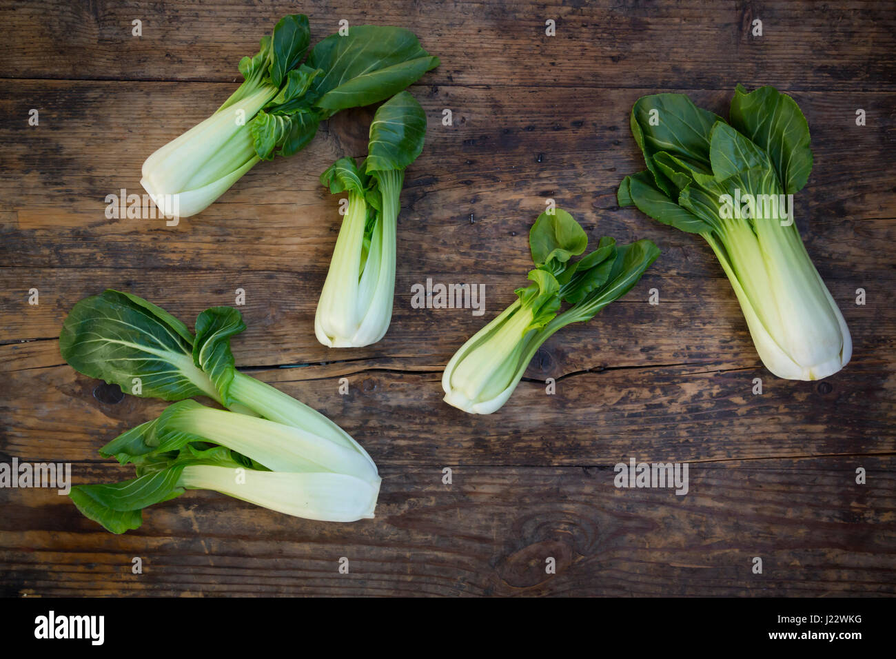 Mini Chinese cabbage on dark wood Stock Photo - Alamy