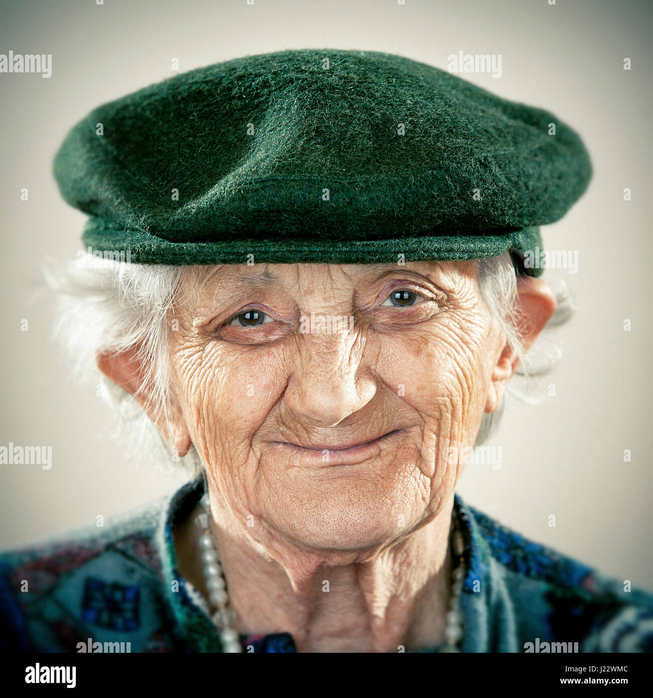 Portrait of an elderly lady wearing a cap Stock Photo - Alamy