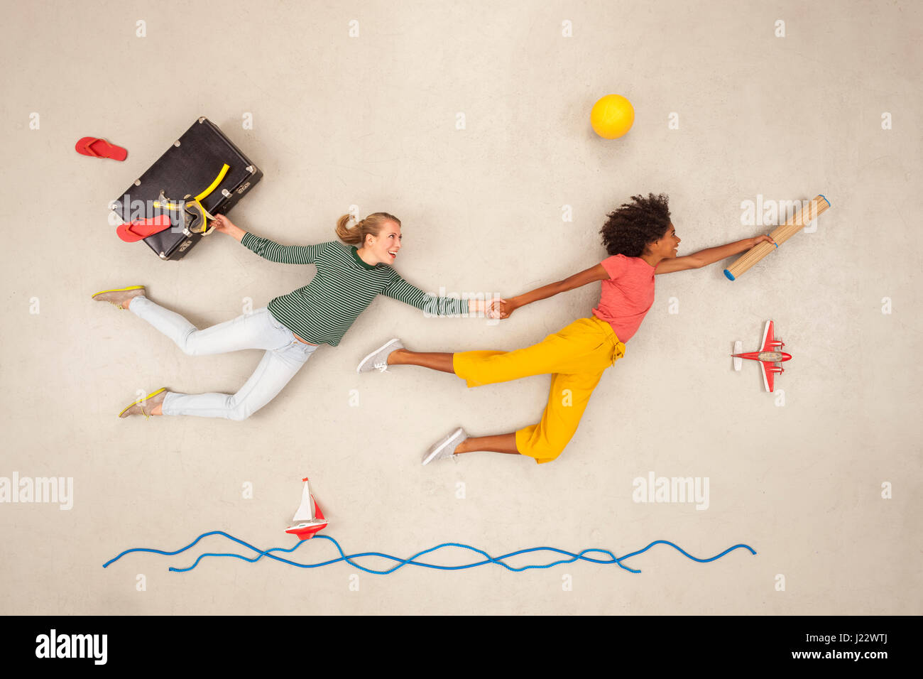 Friends flying to travel destination Stock Photo - Alamy