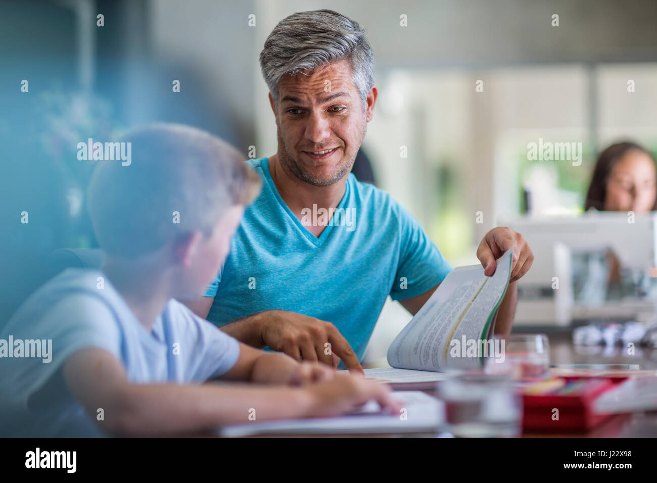 Father helping son doing homework Stock Photo - Alamy Father helping son doing homework Stock Photo - Alamy