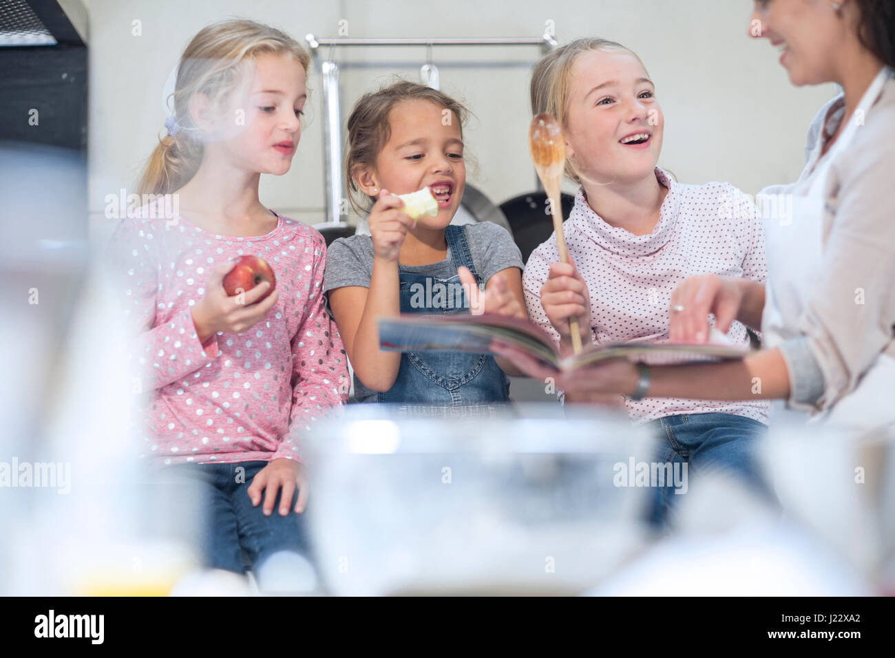 Family cooking together in kitchen Stock Photo - Alamy