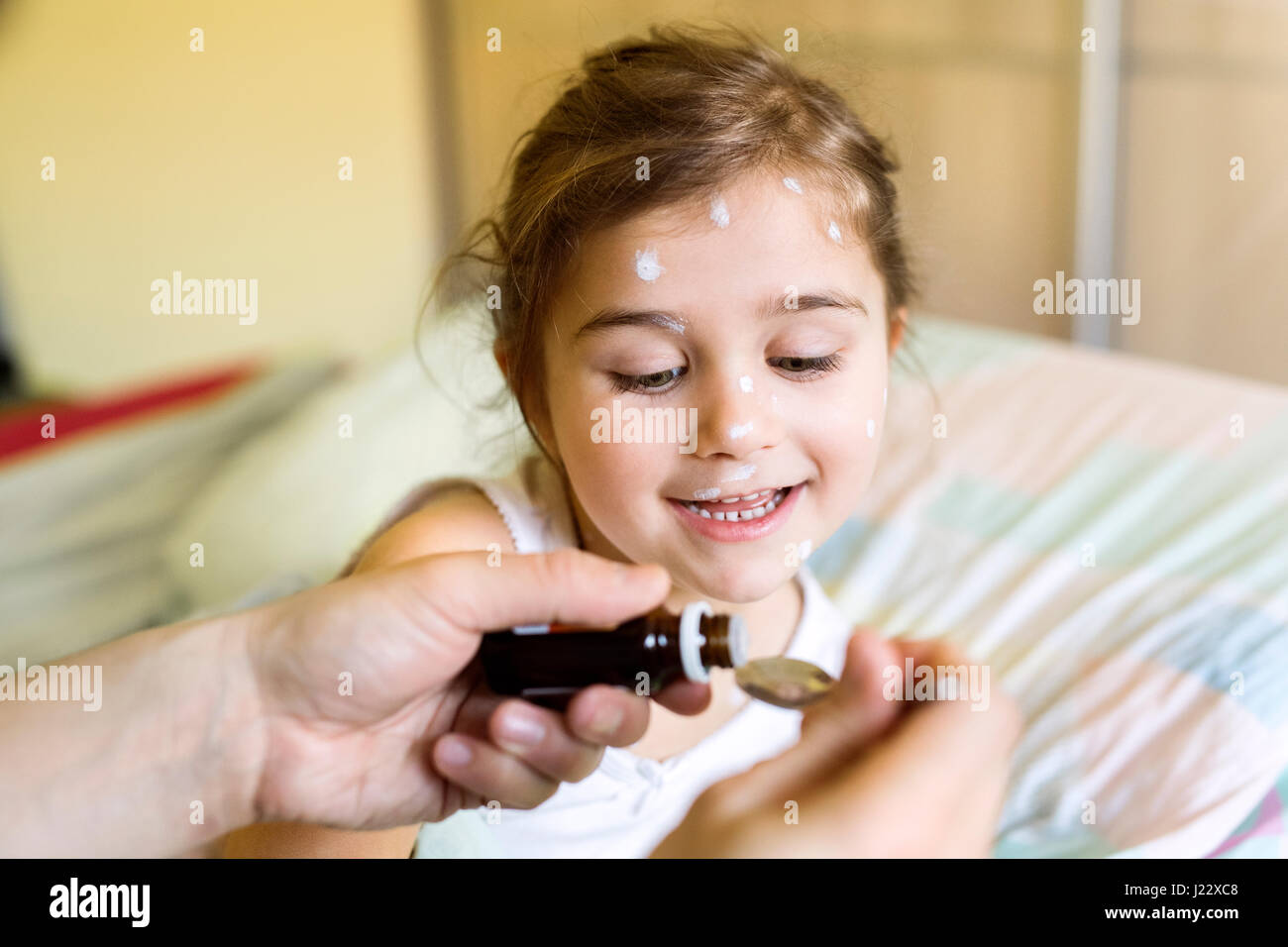 Children receiving medicine hi-res stock photography and images - Alamy