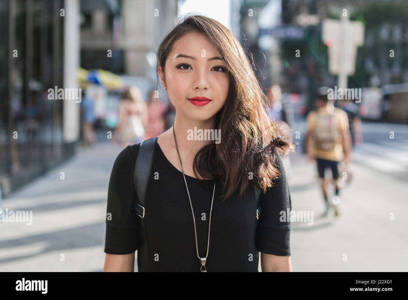 USA, New York City, Manhattan, portrait of young woman dressed in black ...