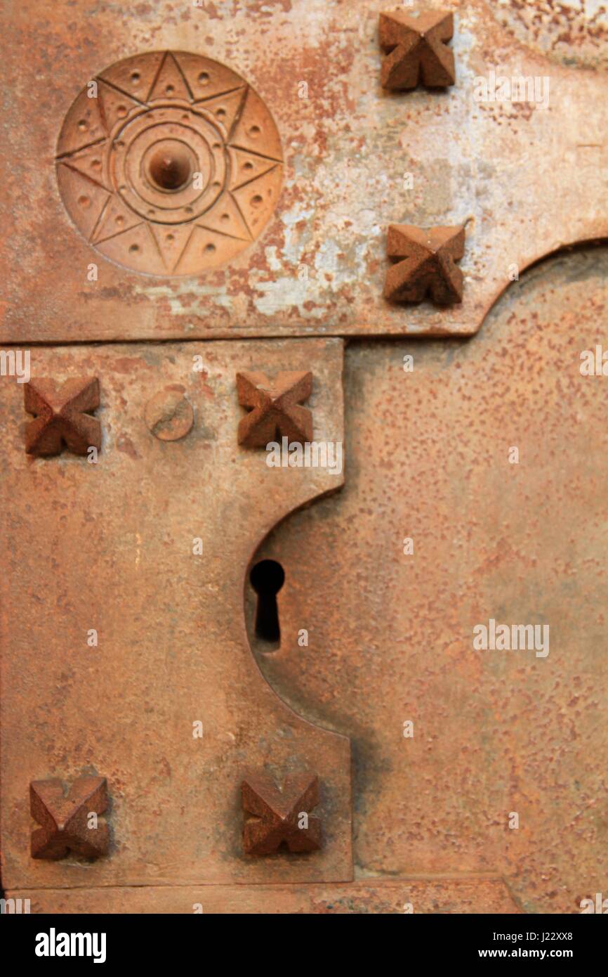 Detail of a medieval keyhole in Siena, Italy Stock Photo - Alamy