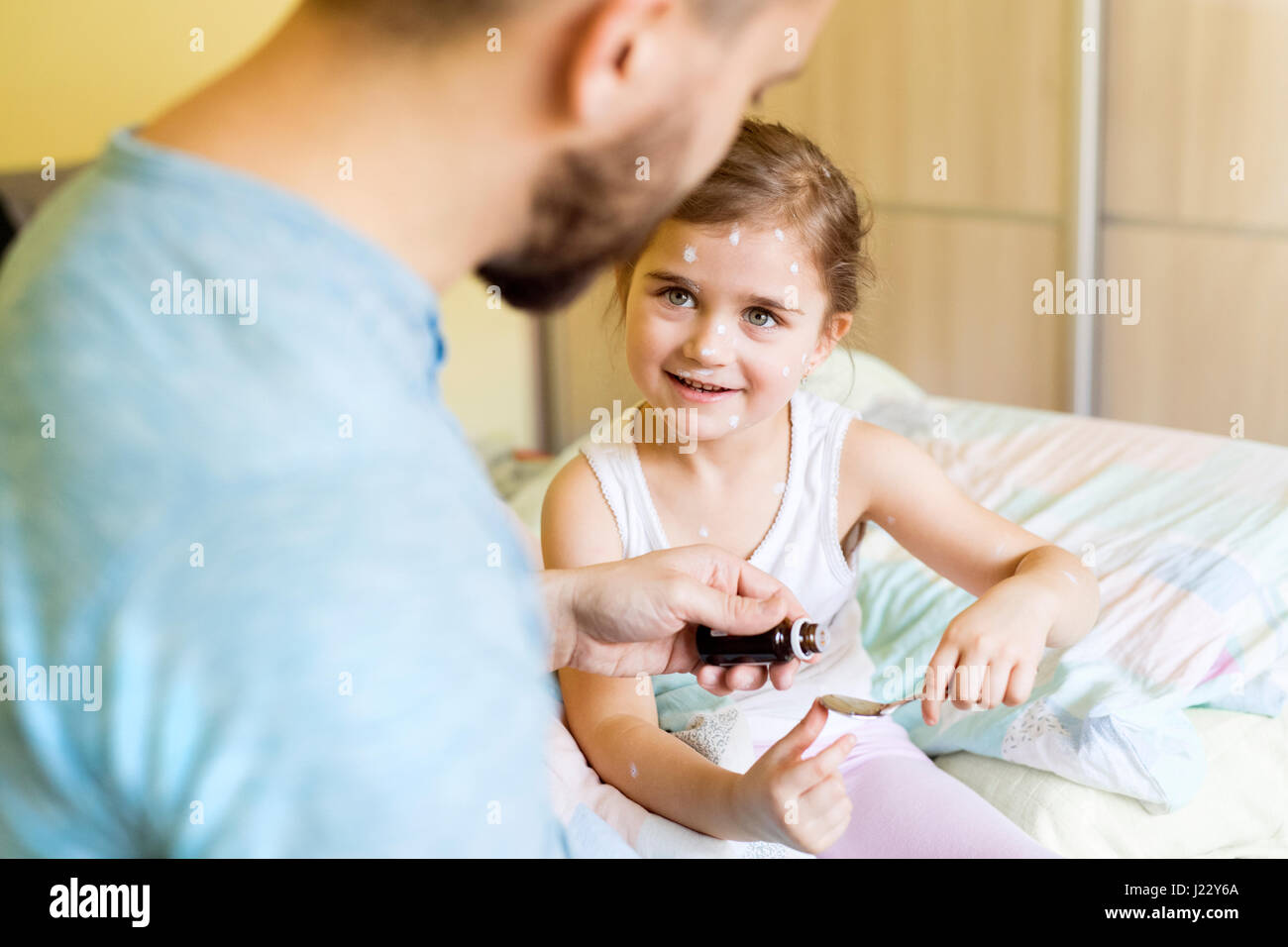 Children receiving medicine hi-res stock photography and images - Alamy