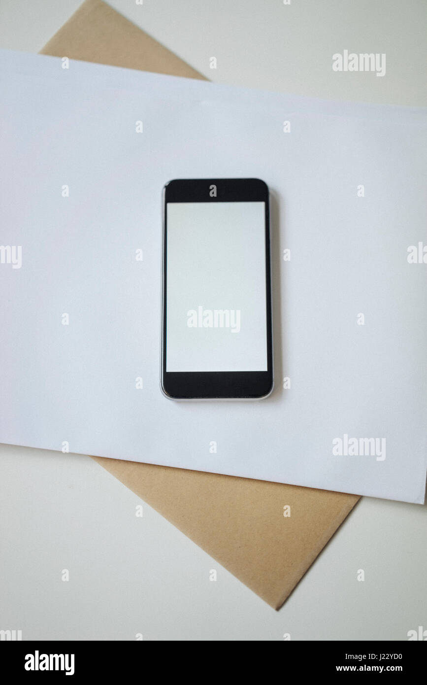 Smartphone on envelopes Stock Photo - Alamy