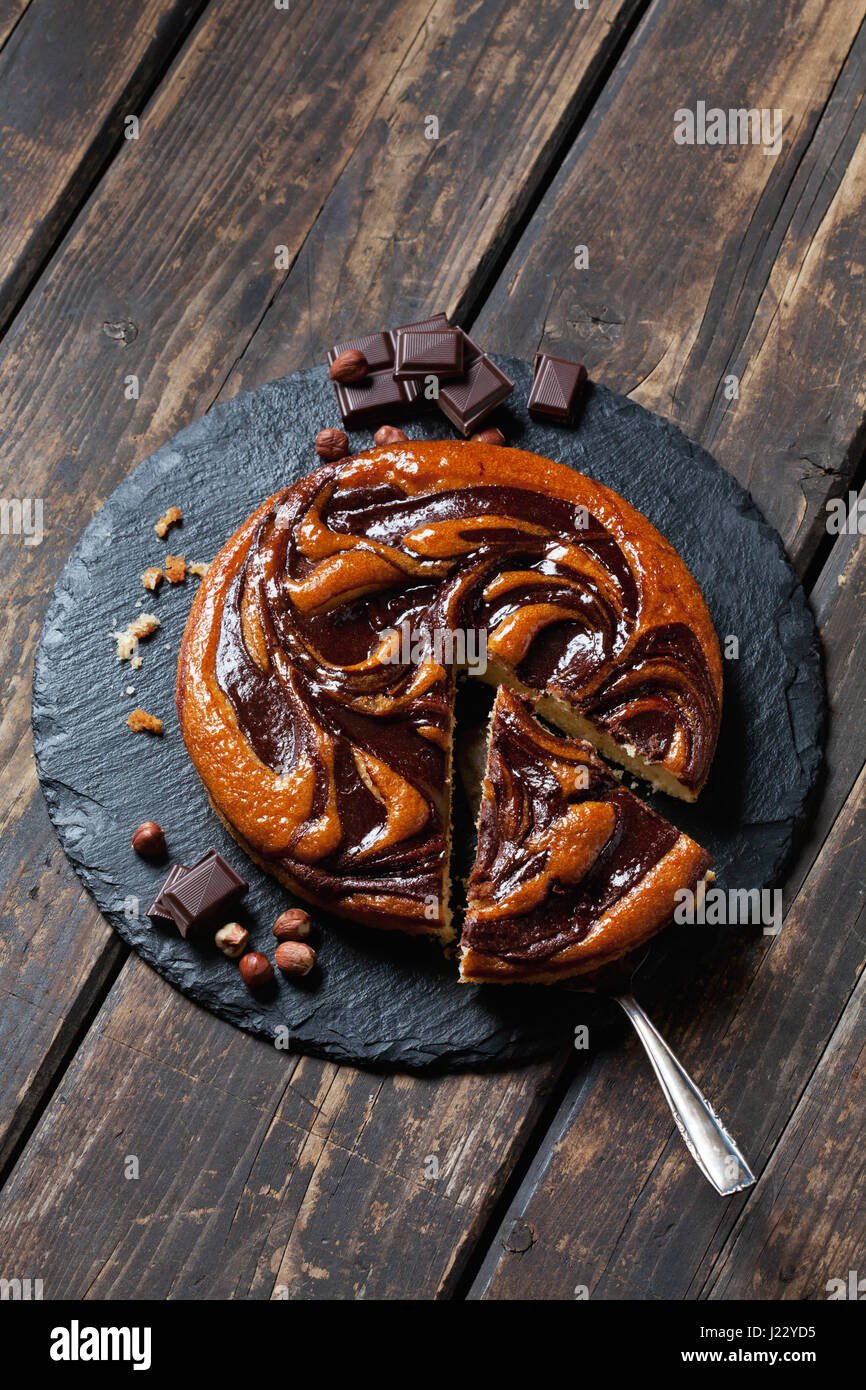 Sliced chocolate cake on slate plate Stock Photo - Alamy