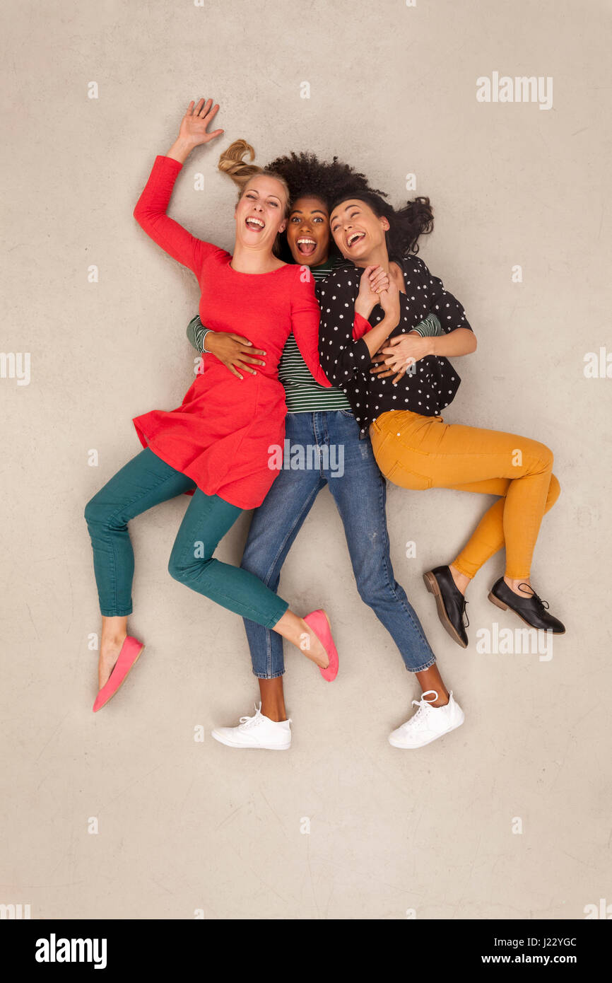 Three girl friends having fun Stock Photo - Alamy