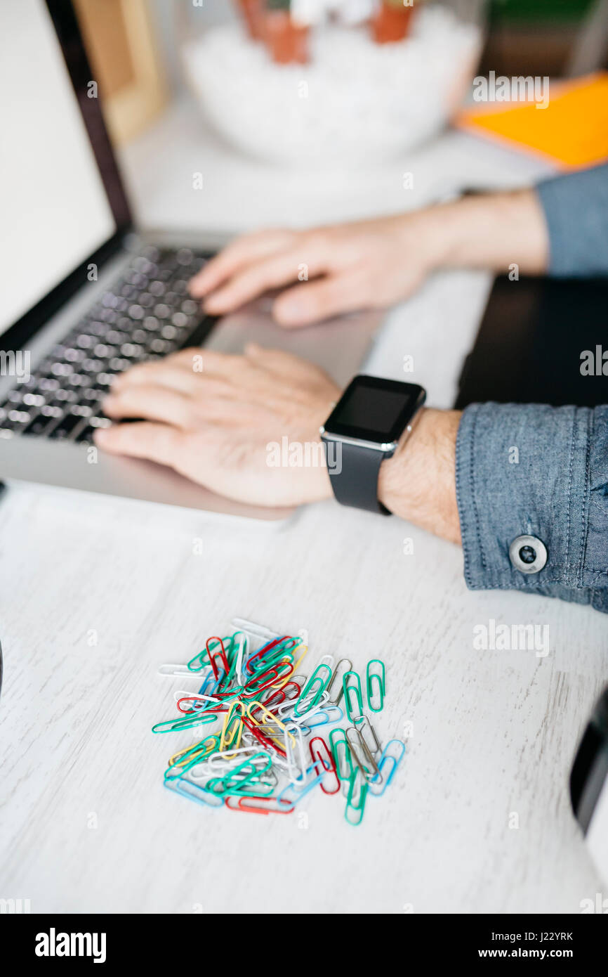 Paper clips on desk Stock Photo - Alamy