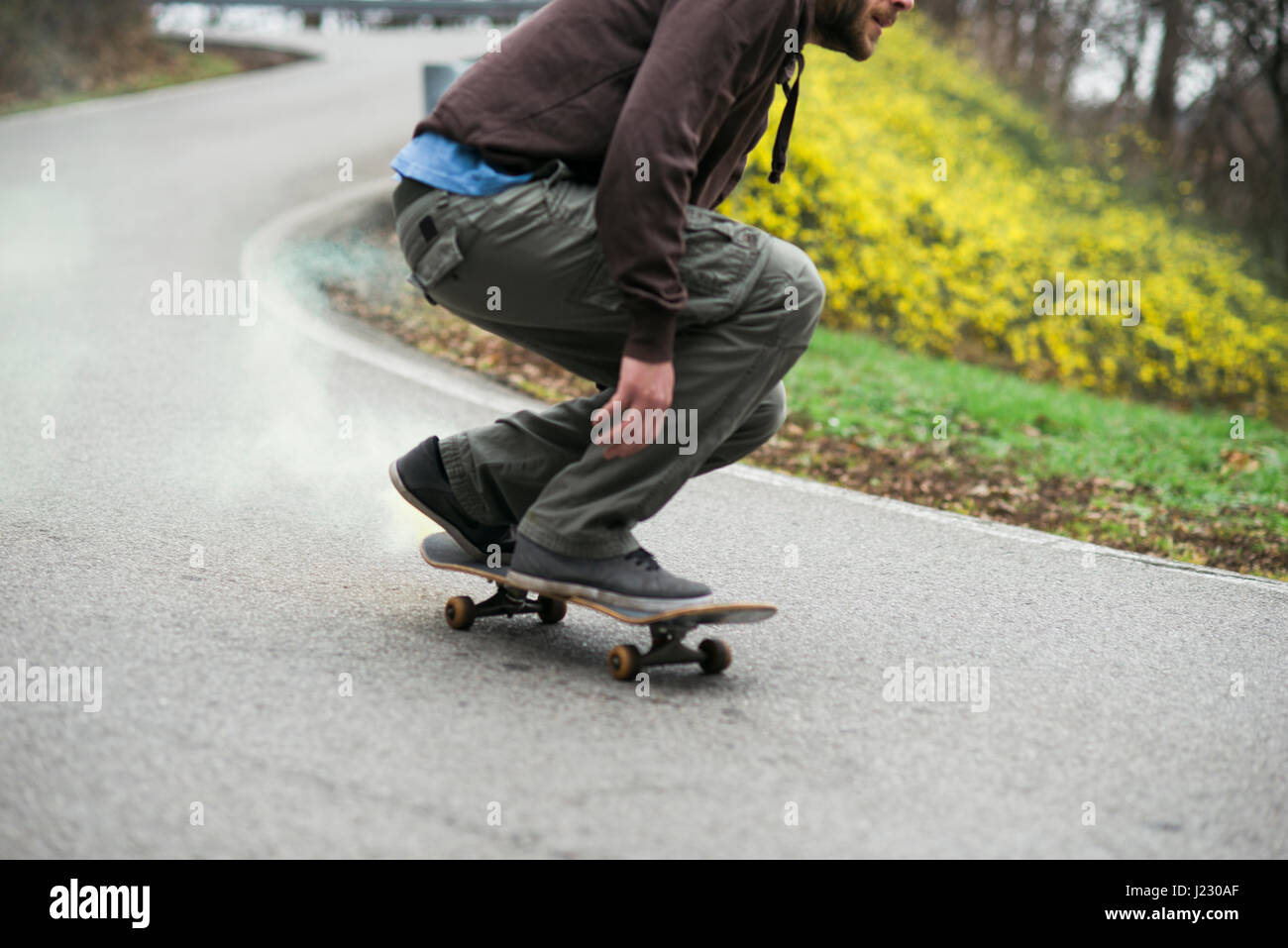 Man skating down the road Stock Photo - Alamy