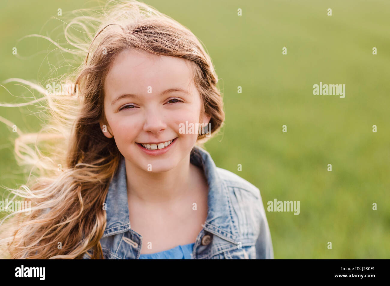 Portrait smiling girl blowing hi-res stock photography and images - Alamy
