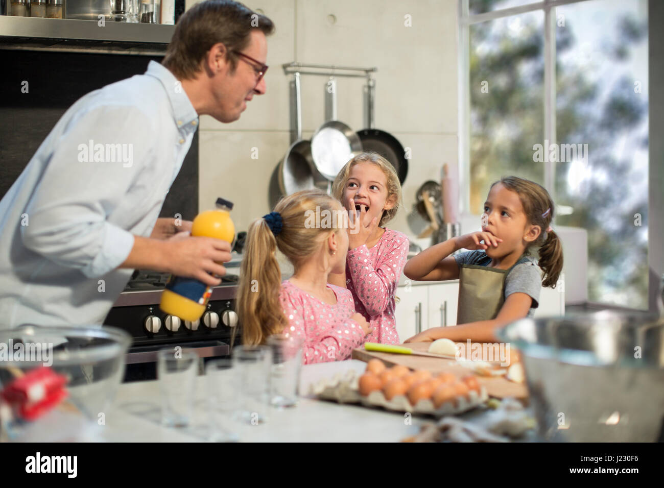 Family cooking together in kitchen Stock Photo - Alamy