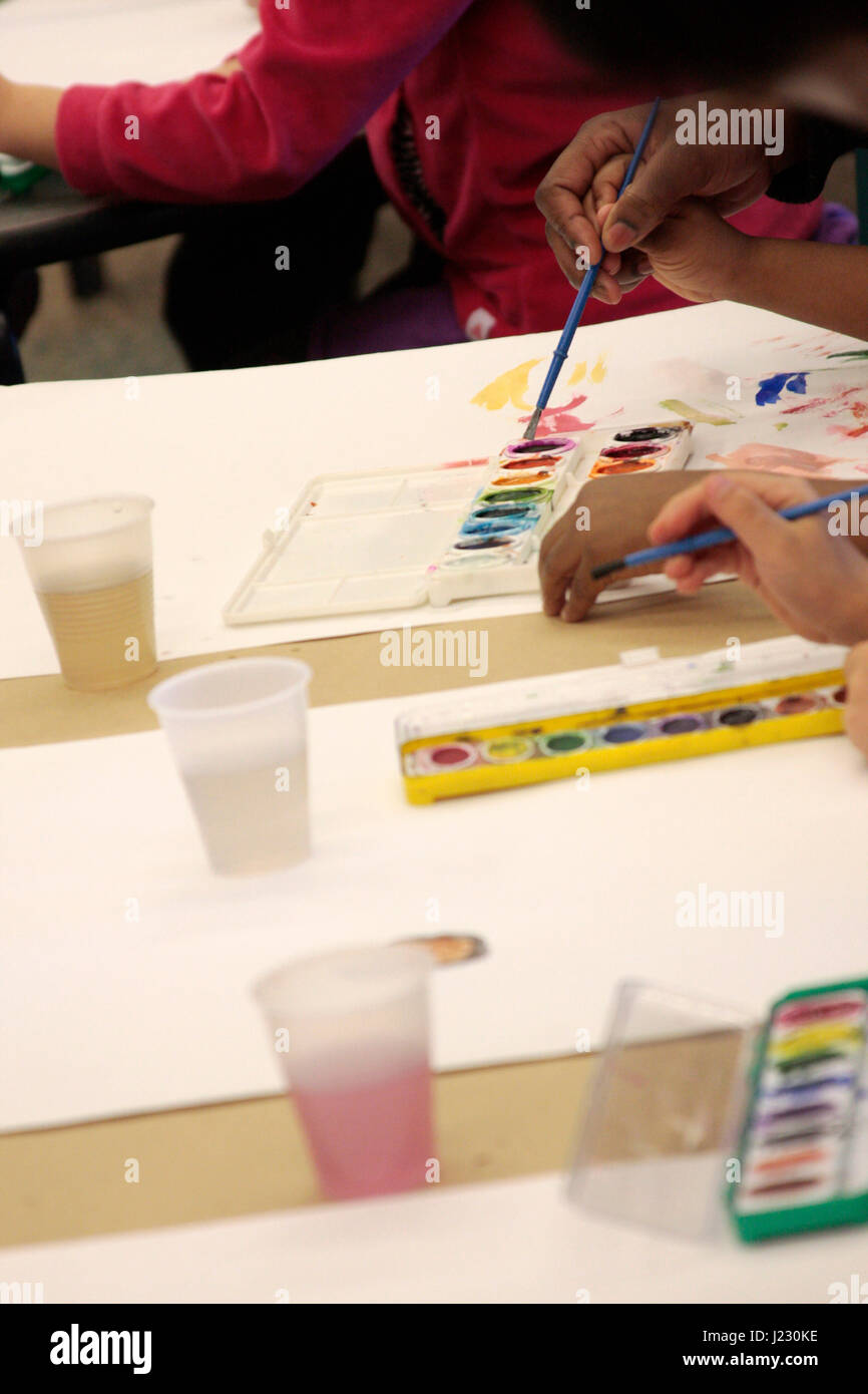 Children Painting with Water Colors Stock Photo - Alamy