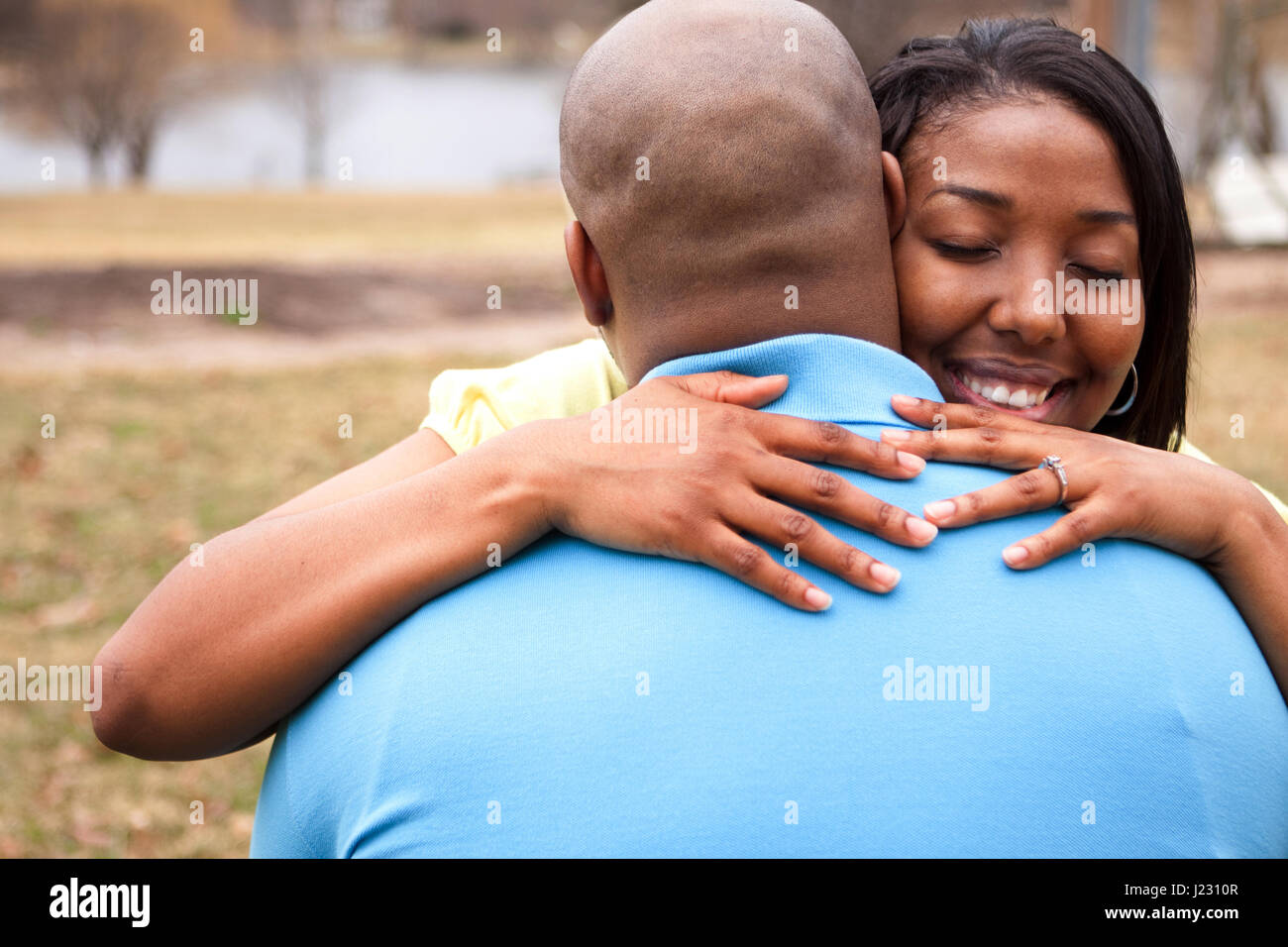 Rear view of a loving African American couple Stock Photo - Alamy
