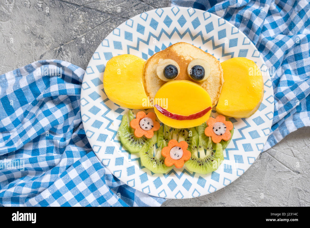 Monkey eating mango fruit hi-res stock photography and images - Alamy