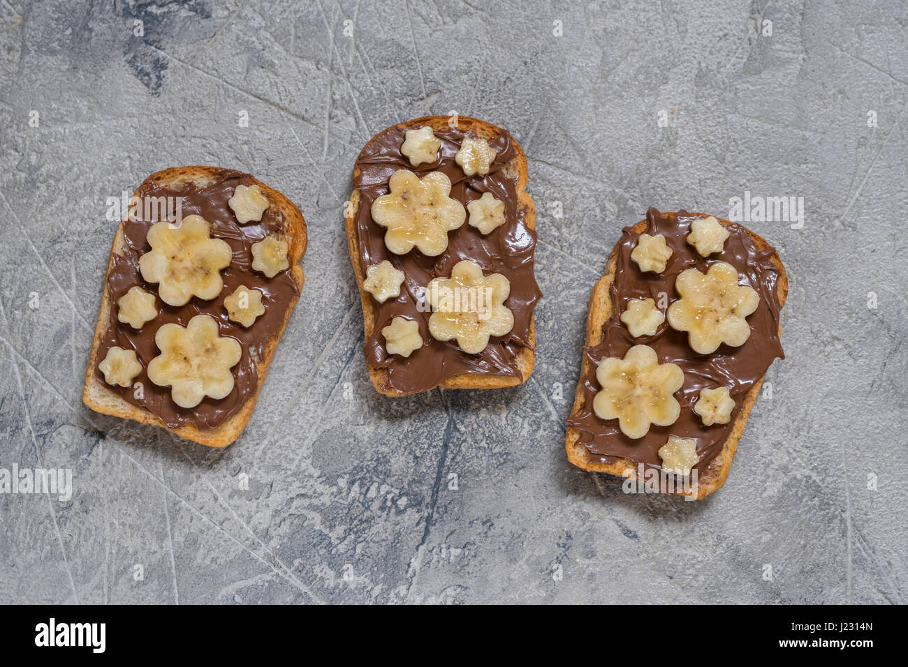 Toast bread with chocolate spread and banana Stock Photo - Alamy
