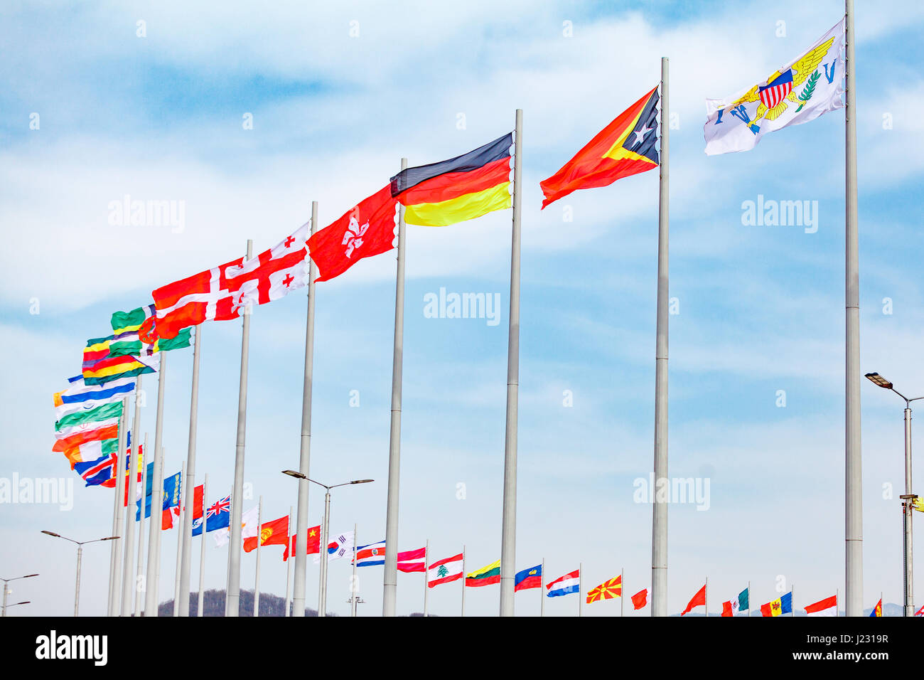 Flags of countries. different countries on the flagpole Stock Photo - Alamy