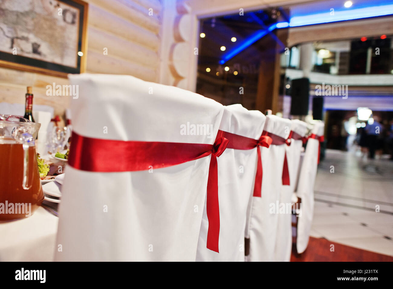 Wedding chairs for guests with red ribbons Stock Photo - Alamy