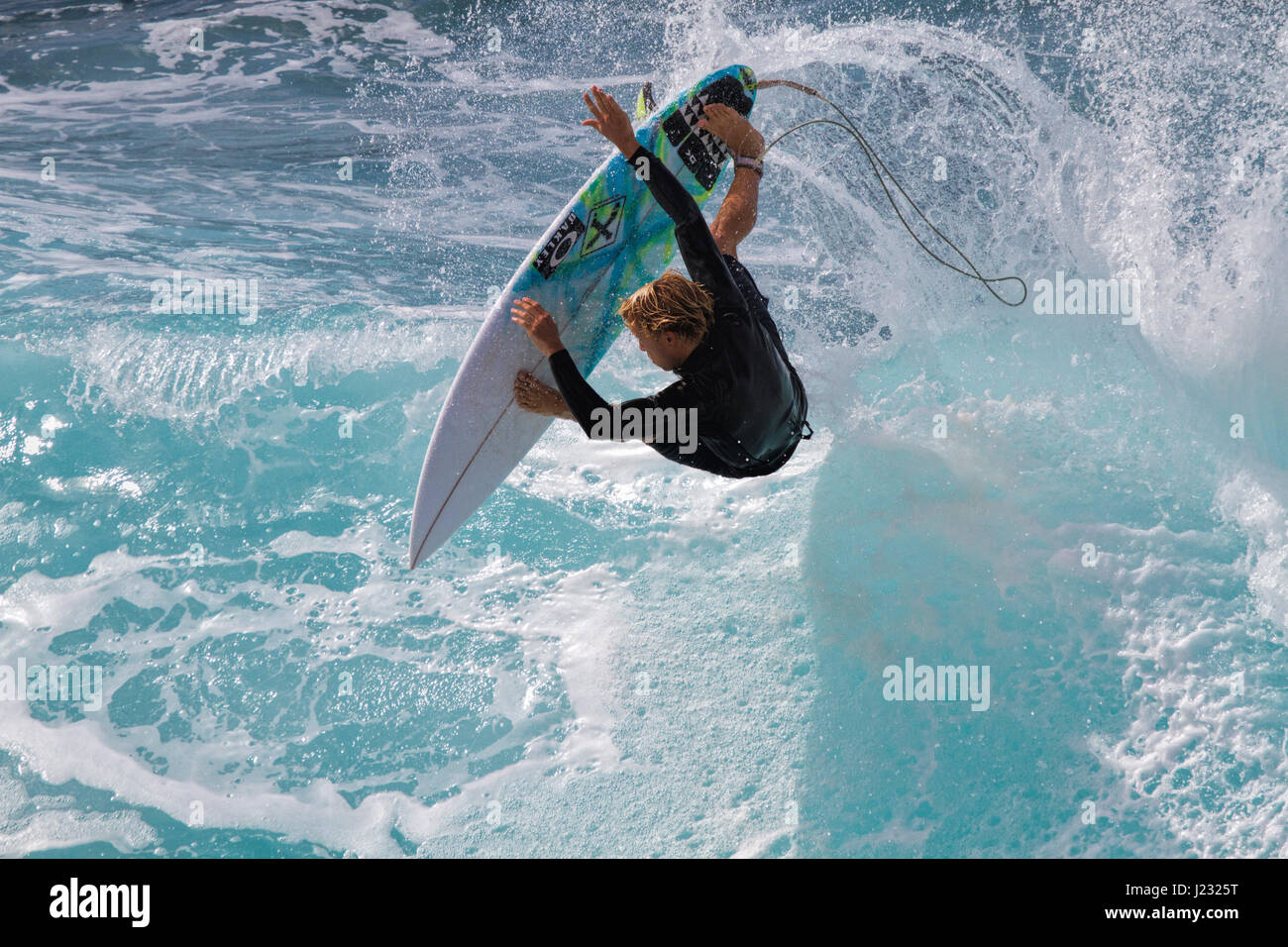 Surfer, defying gravity, at Honolua Bay on Maui Stock Photo - Alamy