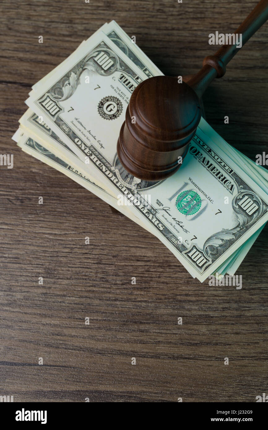 Image of hammer with dollars Stock Photo - Alamy