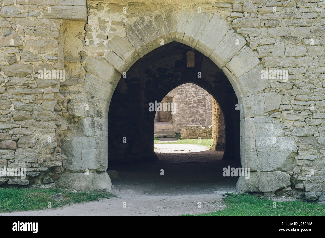 Ancient arch doorway leading through passage of medieval castle Stock ...