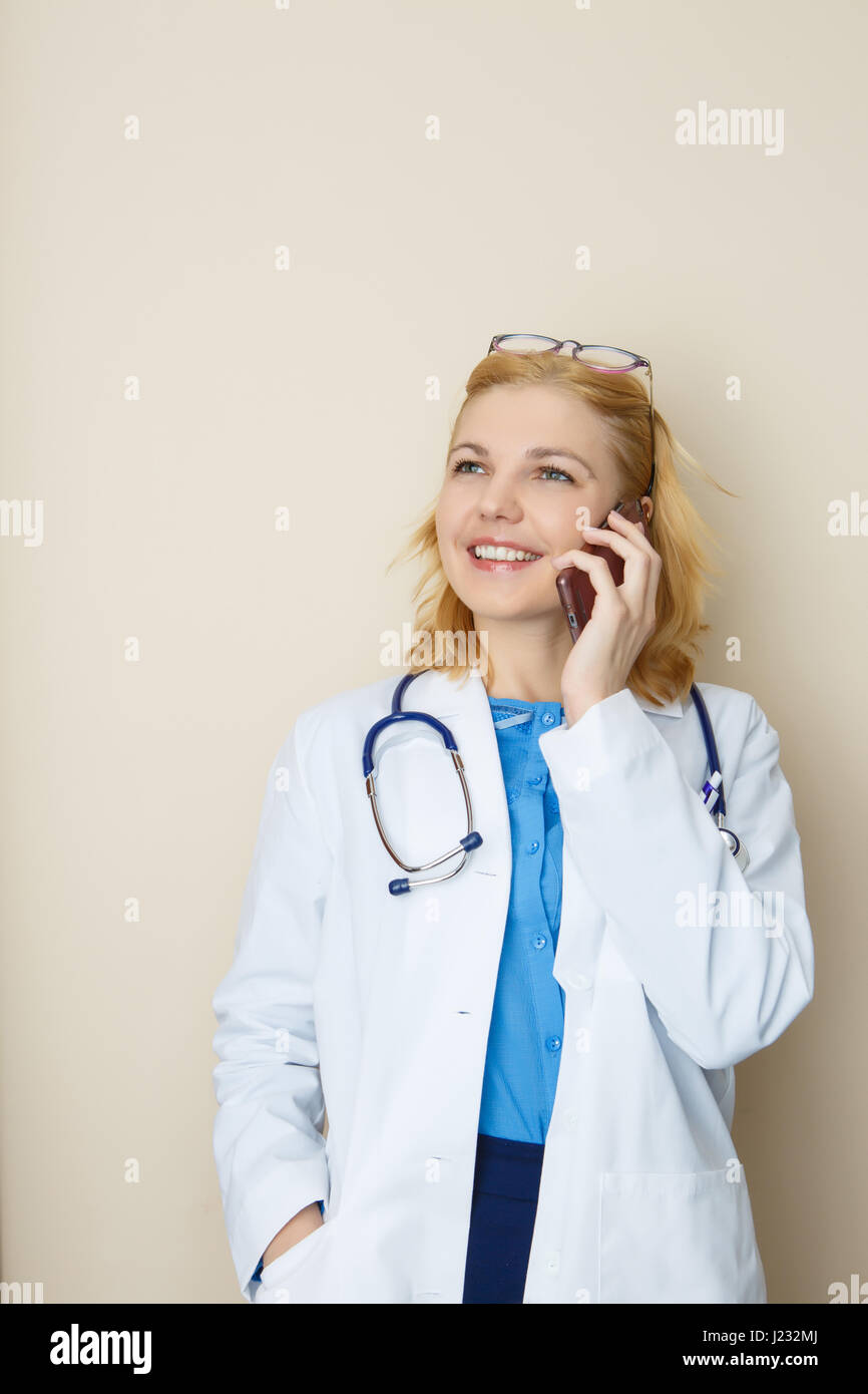 Young blonde talking on phone Stock Photo - Alamy